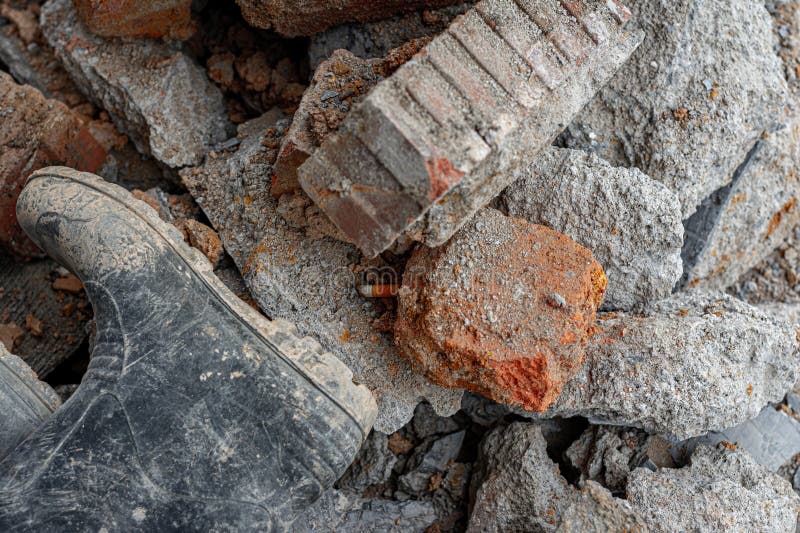 Brick and Concrete Debris with Muddy Boot Stock Image - Image of ...