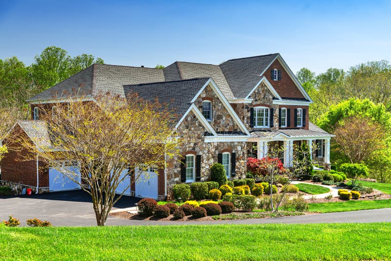 Brick Country House with a Large Lawn and Woods in the Backyard Stock ...