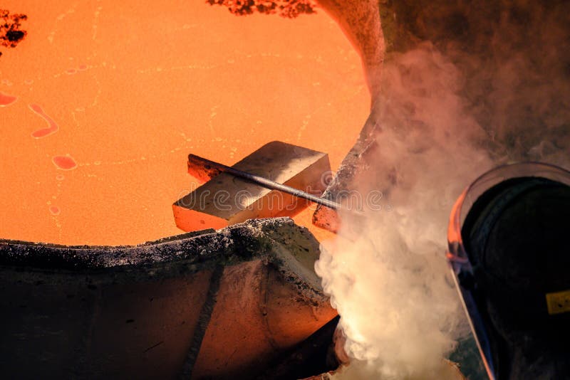 A Brick at the Edge of a Vat with Molten Metal, Floats on the Surface ...