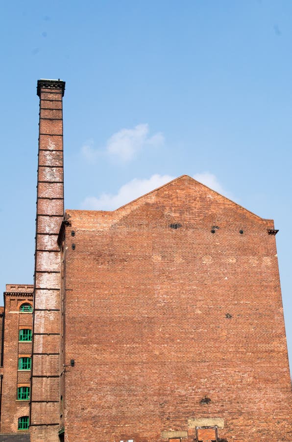 Brick Factory and Chimney Against a Blue Sky Stock Photo - Image of ...