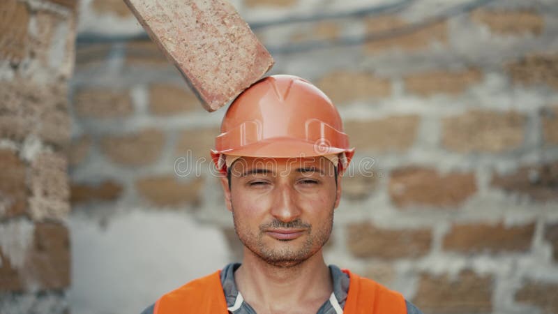 Brick Falls on a Builder S Head Stock Video - Video of helmet, shock ...