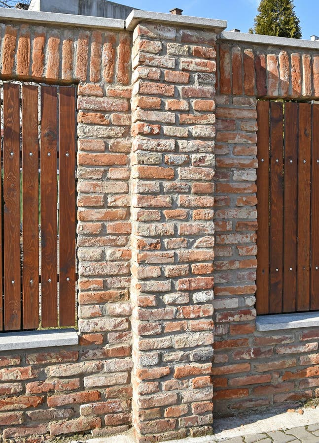 Brick fence of a building stock image. Image of weathered - 143158779