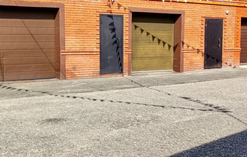 Brick Garage Box with Metal Gates and Roller Shutters Stock Photo ...