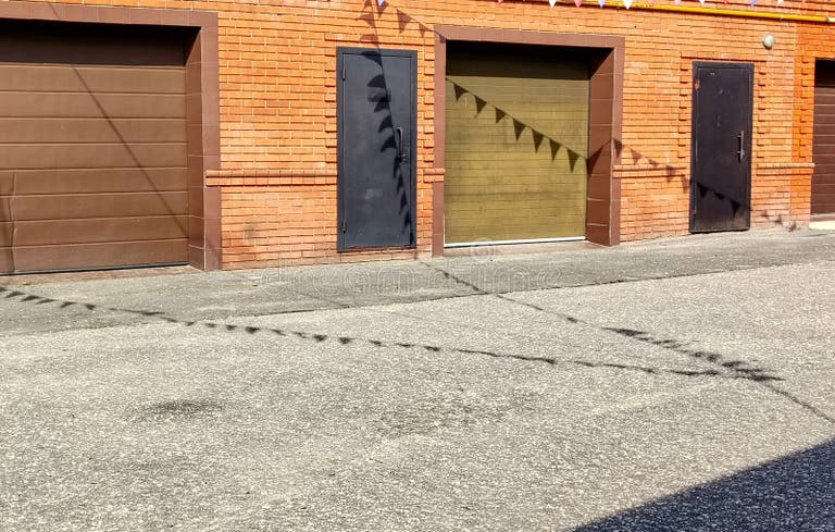 Brick Garage Box with Metal Gates and Roller Shutters Stock Photo ...