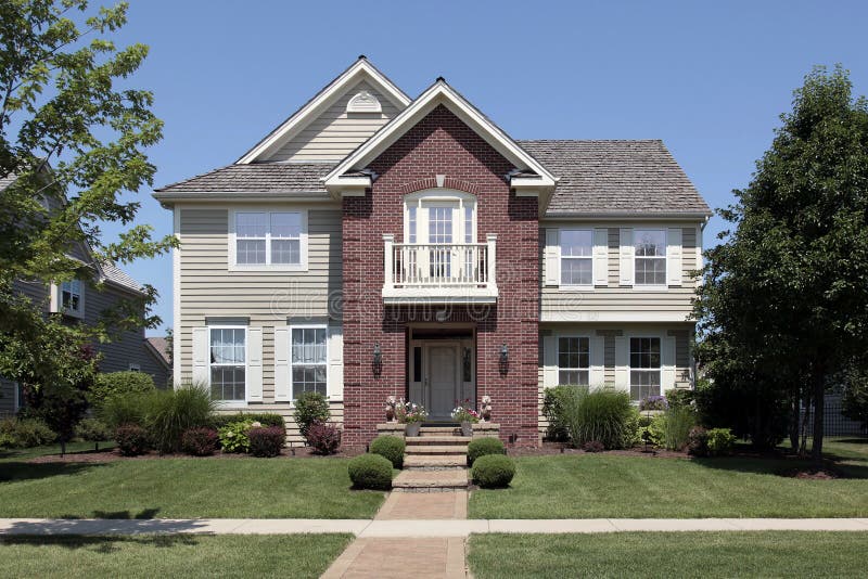 Brick Home with Front Balcony Stock Photo - Image of brick, grass: 21076790
