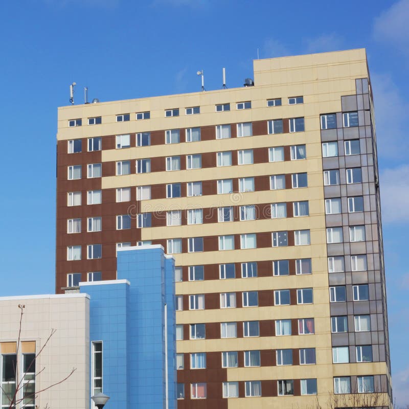 Brick Beige and Brown Building on the Blue Sky Background Stock Image ...