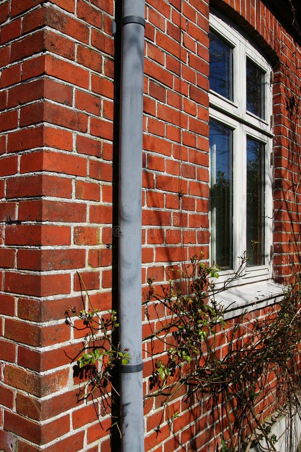 Brick house gutter window stock image. Image of building - 4942337