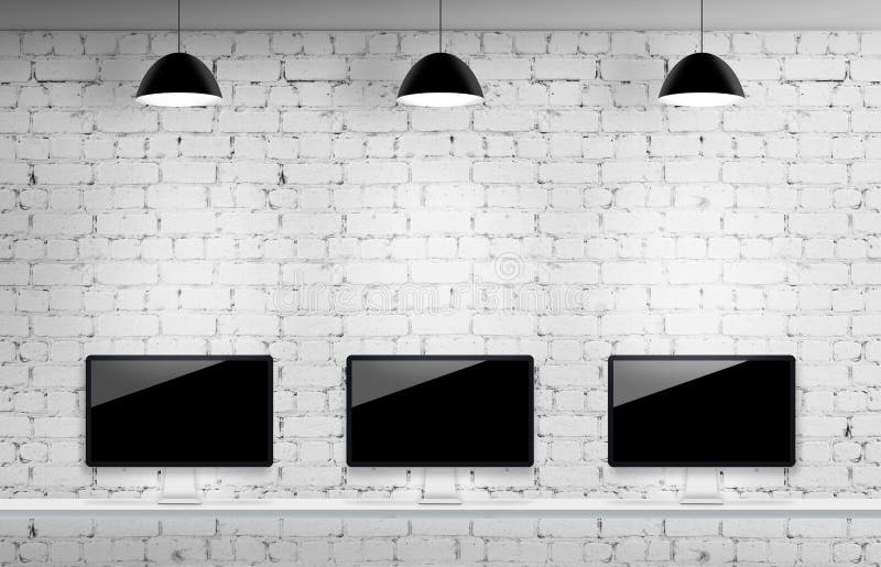 Brick Interior with Three Computer Displays Stock Photo - Image of ...