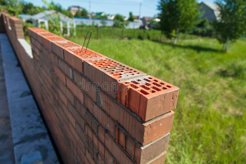 Brick Laying in the Wall at a Construction Site at Home Stock Image ...