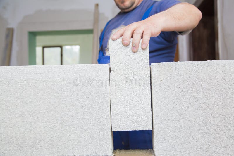 Brick-laying working hands stock image. Image of basis - 78917001