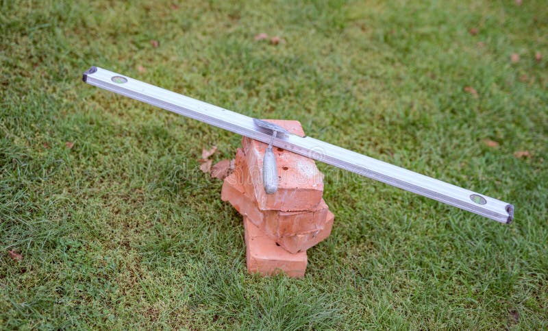Brick and Measuring Level and Spatula Stock Photo - Image of level ...