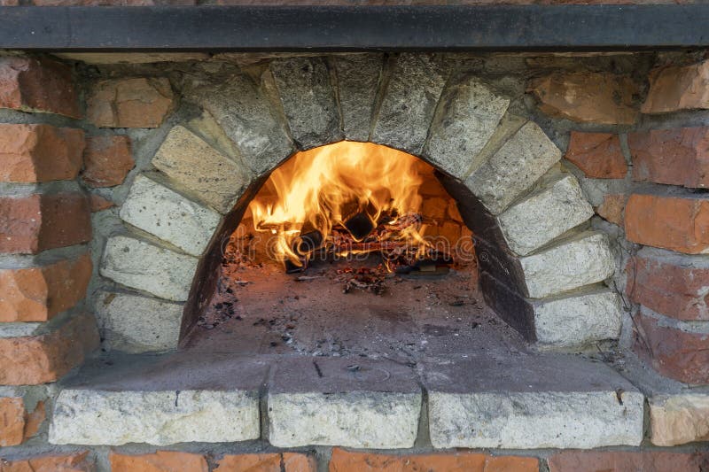 Brick Oven for Cooking. Burning Fire in Stone Oven, Closeup Stock Photo ...