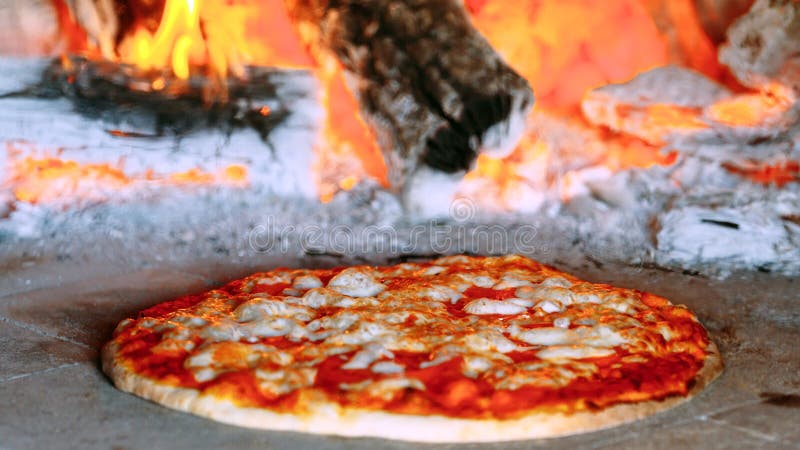 Brick Pizza Oven,Cooking Italian Pizza in a Brick Oven Stock Image ...