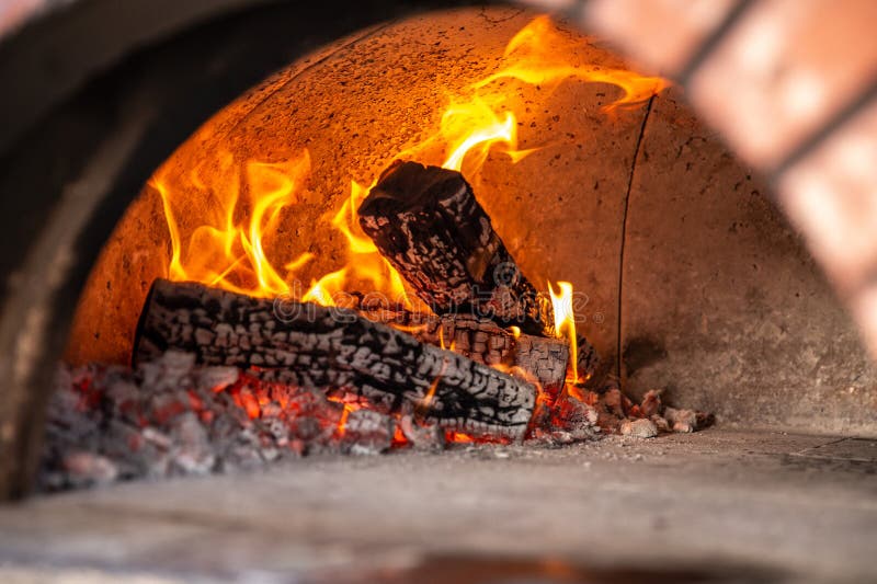 Brick Pizza Oven,Cooking Italian Pizza in a Brick Oven Stock Image ...