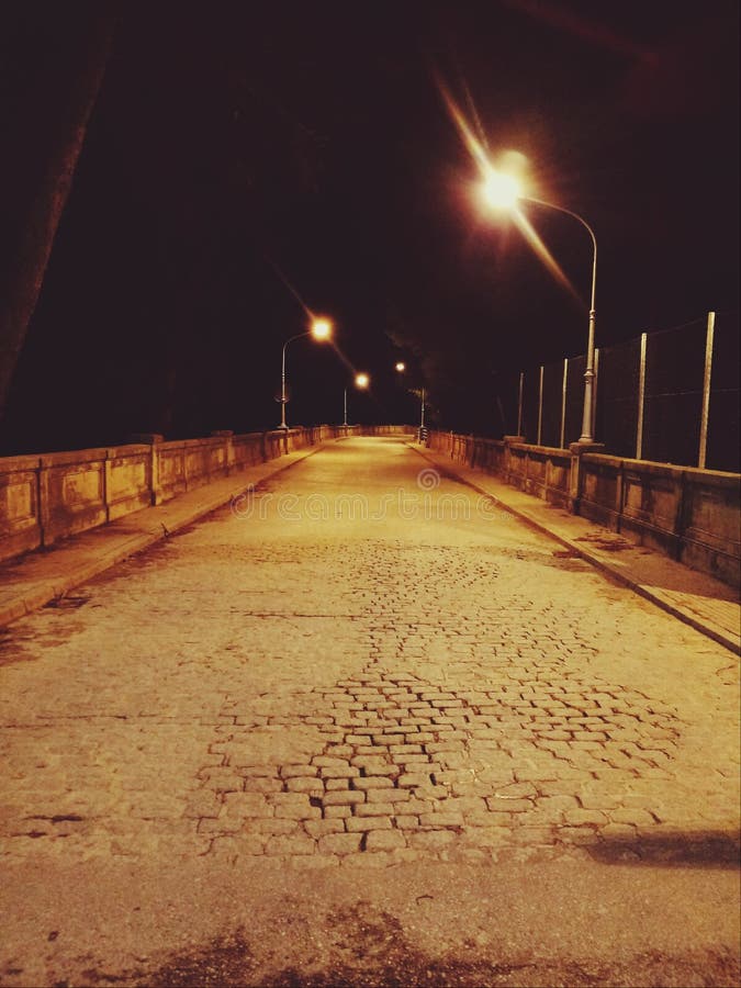 A Brick Path at Night Time with Street Lights Stock Photo - Image of ...