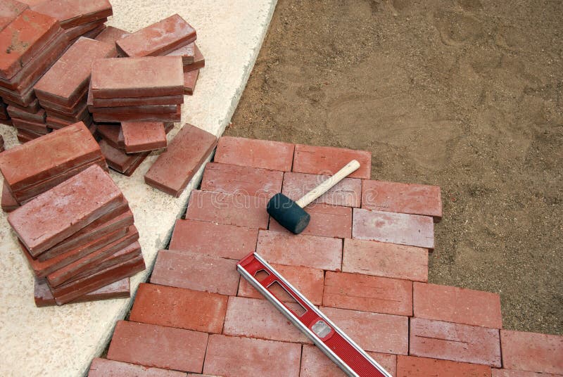 Brick Paving Tools stock image. Image of instrument, pavers - 10902417