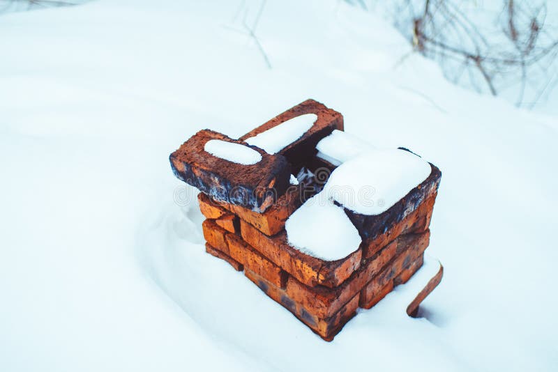 Brick pipe in the snow stock photo. Image of building - 109258646