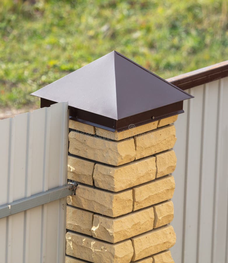 Brick Post in a Metal Fence Stock Photo - Image of wall, garden: 195555006
