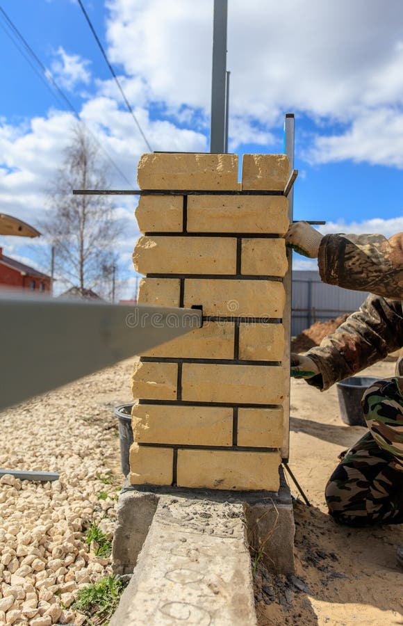 Brick Posts on a Fence As a Background Stock Image - Image of stone ...