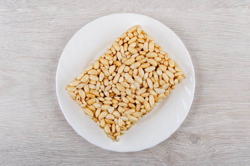 Brick of Puffed Rice in Glass Plate on Wooden Table Stock Photo - Image ...