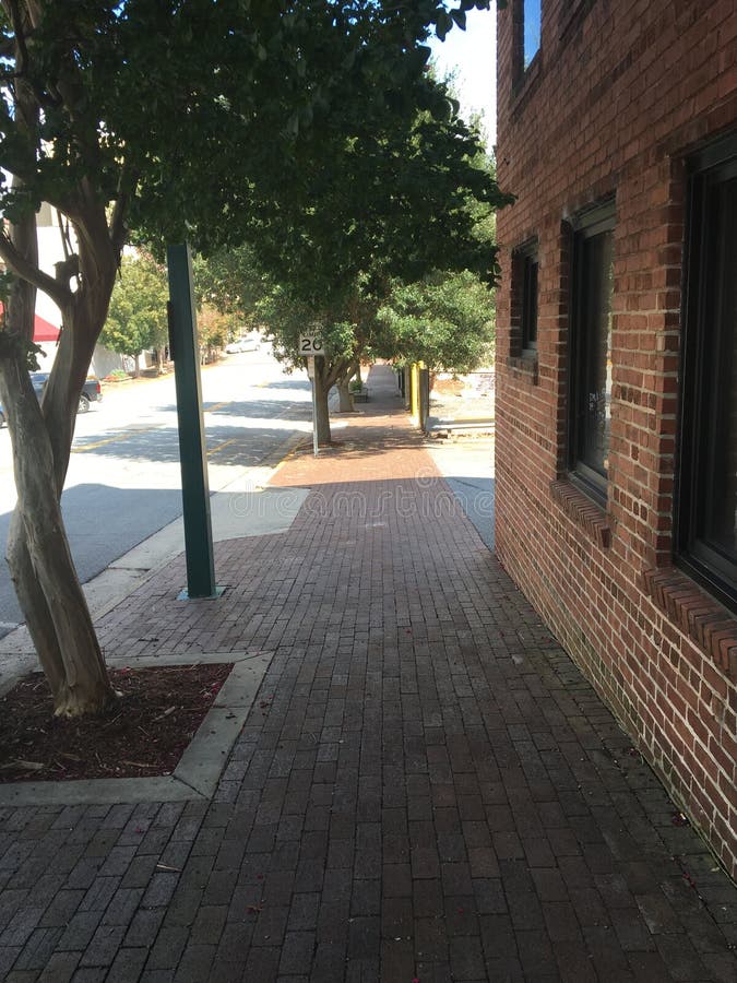 Brick Sidewalk 2 stock photo. Image of never, fell, rider - 76591214