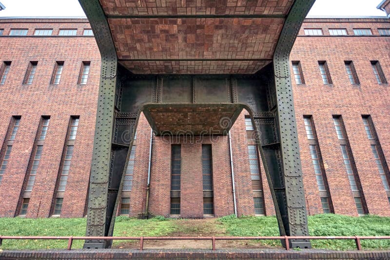 Brick and Steel Pillar of a Bridge, in Front of an Old Industry ...