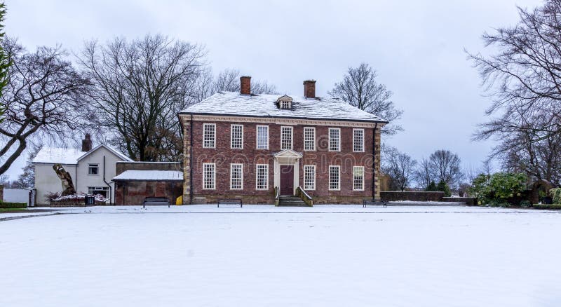 Brick Two-story Building in Winter with a Blue Sky on the Horizon ...
