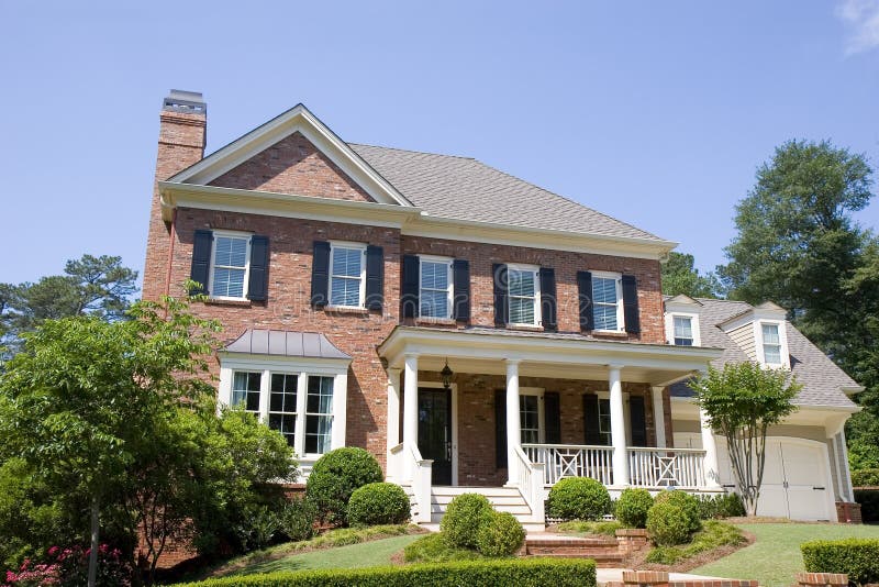 Brick Two Story With Porch Picture. Image: 5745838