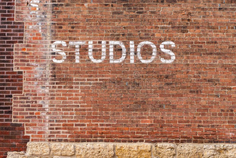 Brick wall in alley stock photo. Image of weathered - 313131386