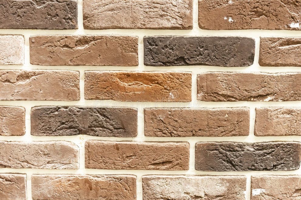 Brick Wall of Beige and Brown Bricks. Background and Texture of ...