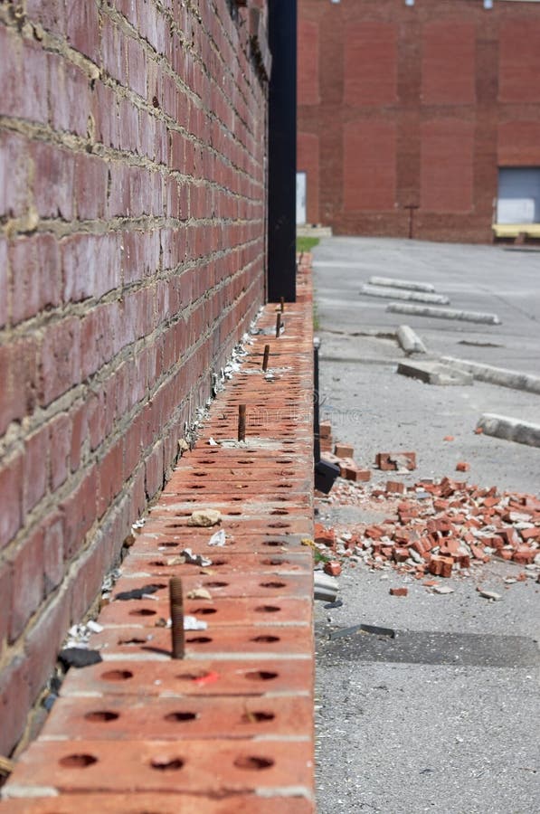 Brick Wall and a Brick Ledge with Rusty Anchor Bolts Stock Photo ...