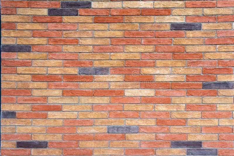 Brick Wall with Bricks in Various Colors, Primarily in Shades of Red ...