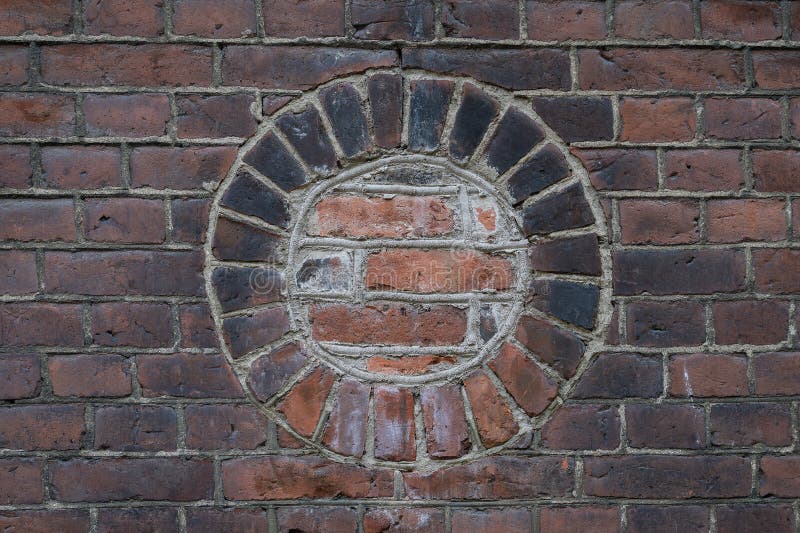 A Brick Wall with a Circle Design Made of Bricks. Stock Image - Image ...