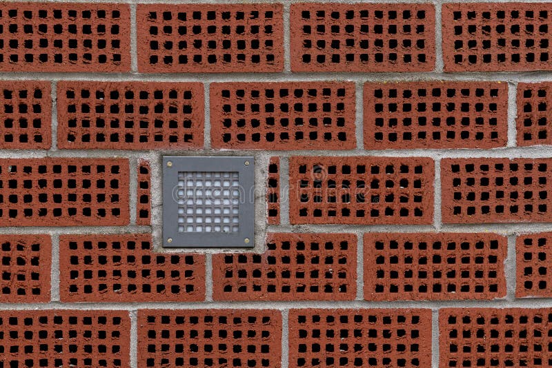 Brick Wall with Decorative Ventilation Blocks and a Light Fixture Stock ...