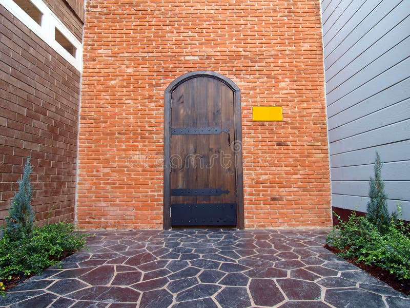 Brick Wall with a Door stock image. Image of bars, house - 23483175