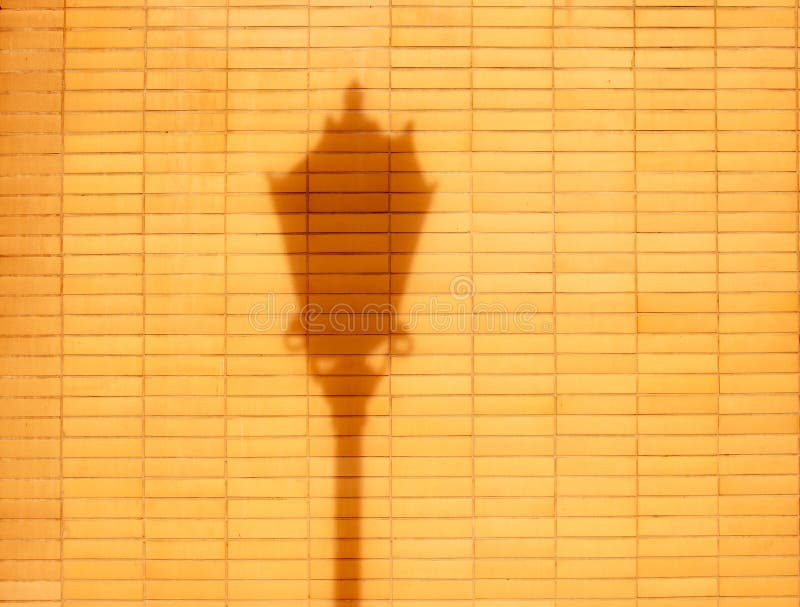 Brick Wall and Drop Shadow from Street Lamp Stock Photo - Image of ...