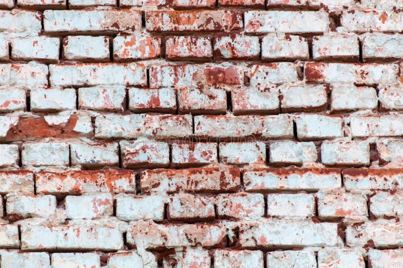 A Brick Wall with a Few Red Bricks Showing through Stock Photo - Image ...