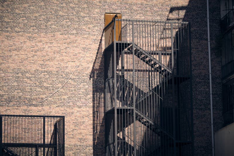 Brick Wall with Fire Escape Stock Image - Image of building ...