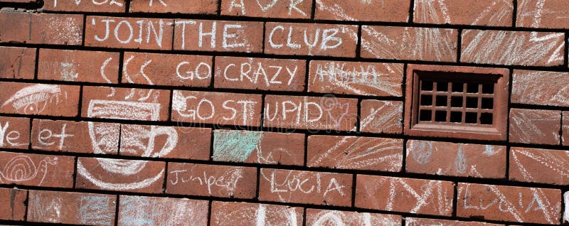 Brick Wall of Graffiti Messages Stock Photo - Image of blue, artist ...