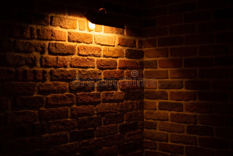 Brick Wall Illuminated by Warm Light from a Lamp Stock Image - Image of ...