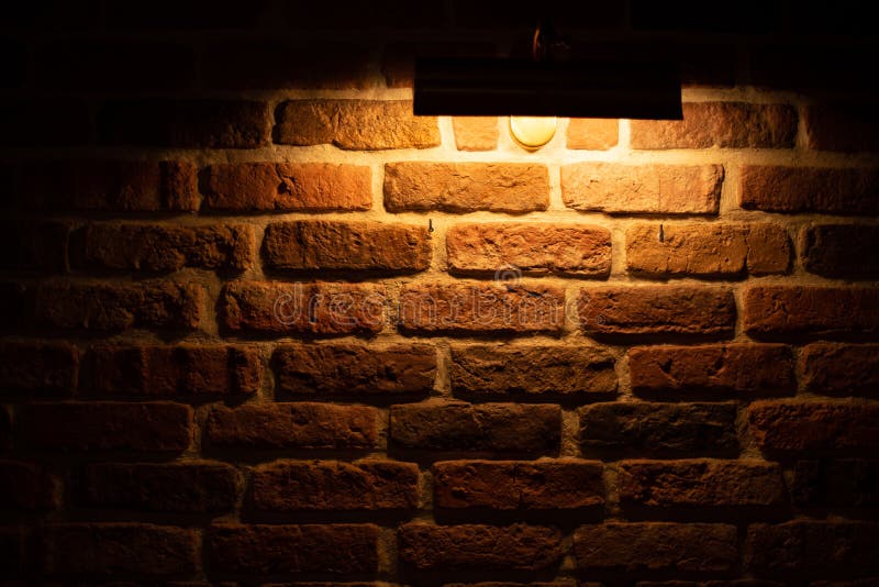 Brick Wall Illuminated by Warm Light from a Lamp Stock Image - Image of ...