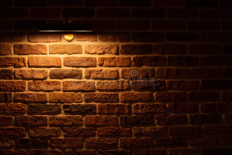 Brick Wall Illuminated by Warm Light from a Lamp Stock Image - Image of ...