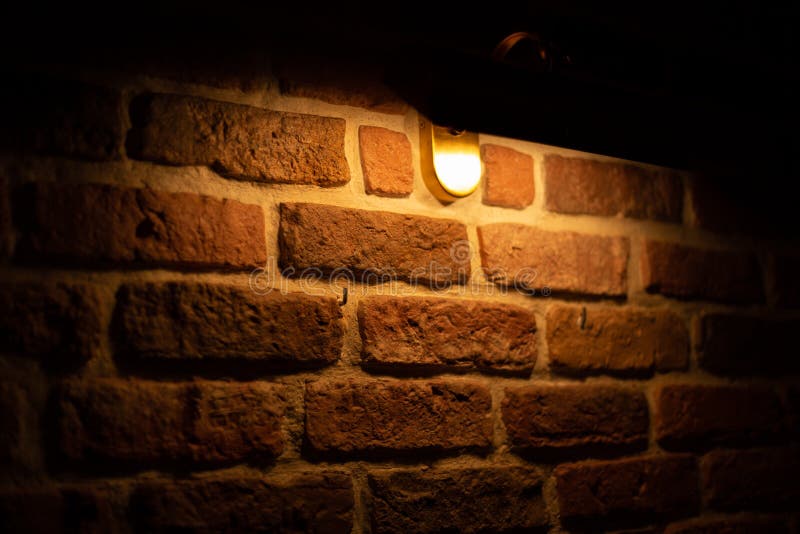 Brick Wall Illuminated by Warm Light from a Lamp Stock Photo - Image of ...