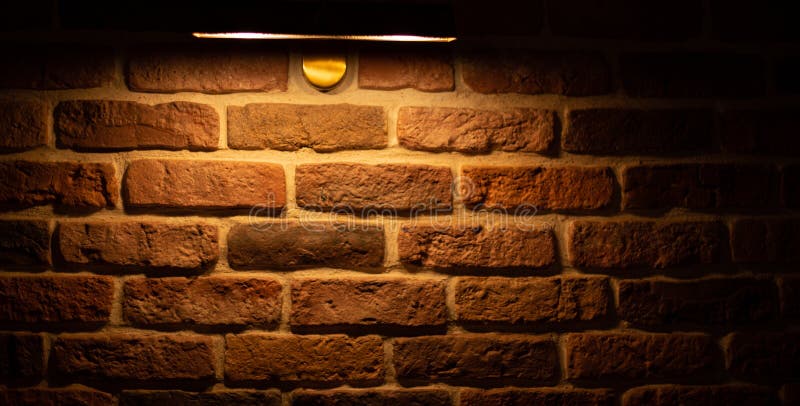Brick Wall Illuminated by Warm Light from a Lamp Stock Photo - Image of ...