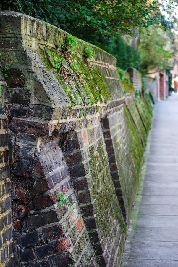 Brick Wall with Interesting Angles and Covered in Moss Stock Photo ...