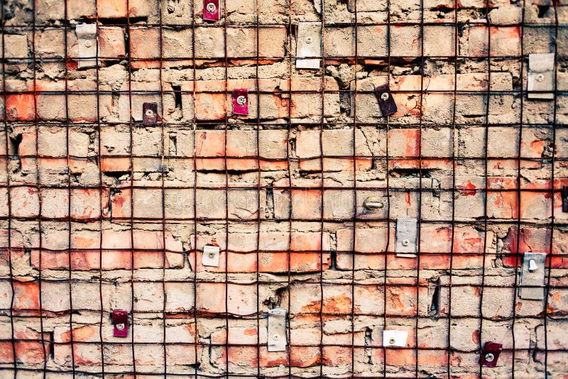 Brick wall with iron grid stock photo. Image of grunge - 41425478