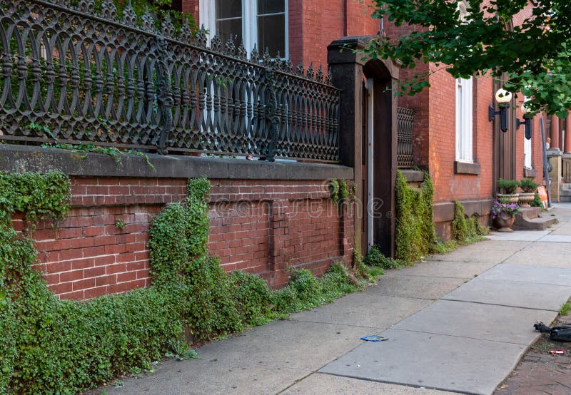 Brick Wall and Iron Railing Stock Photo - Image of brown, ornamental ...