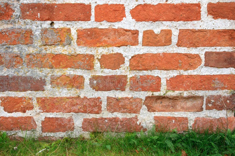 Brick wall and lawn. stock image. Image of dirty, wall - 11612603