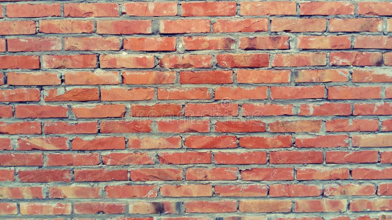 Brick Wall Made of Bright Red Bricks. Lightly Worn Surface. Neat ...
