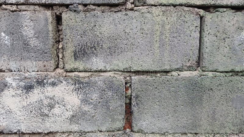 Brick Wall Made of Gray Bricks. Some Bricks are Painted with White ...